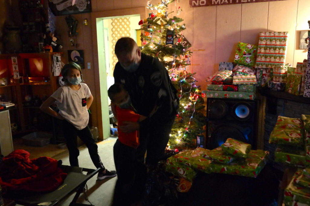 Rudolph the red-nosed fire truck lights the way for giving tree ...